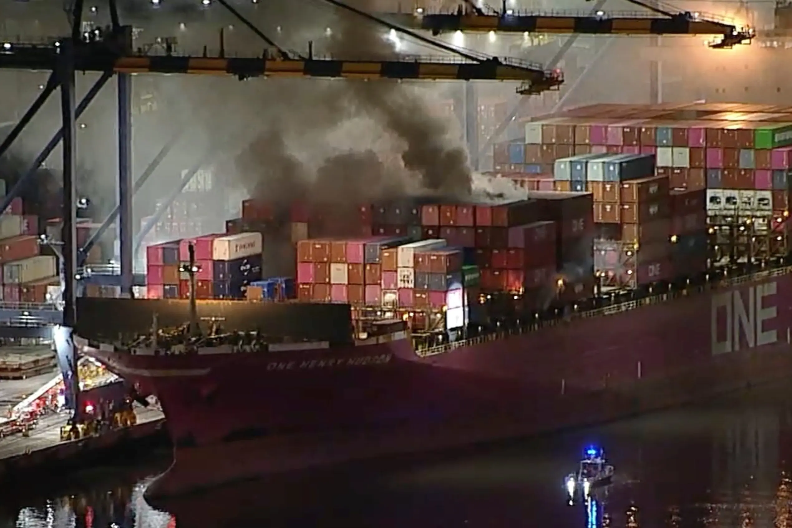 Dozens of firefighters battle blaze on container ship docked at LA port ...