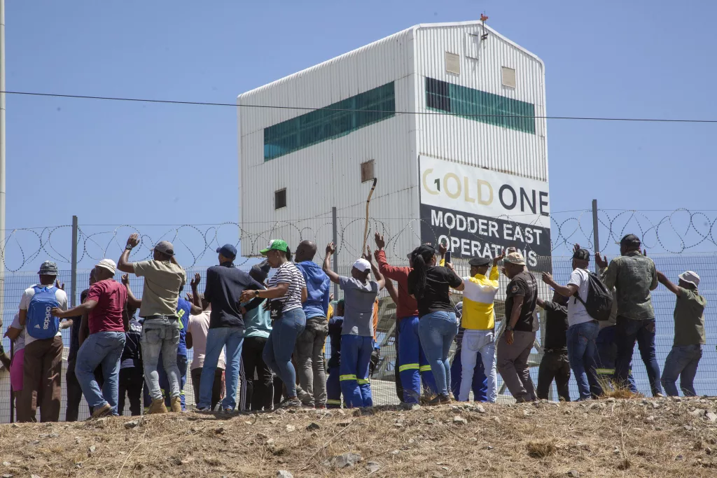 Police say miners from a rival union are holding hundreds of colleagues ...