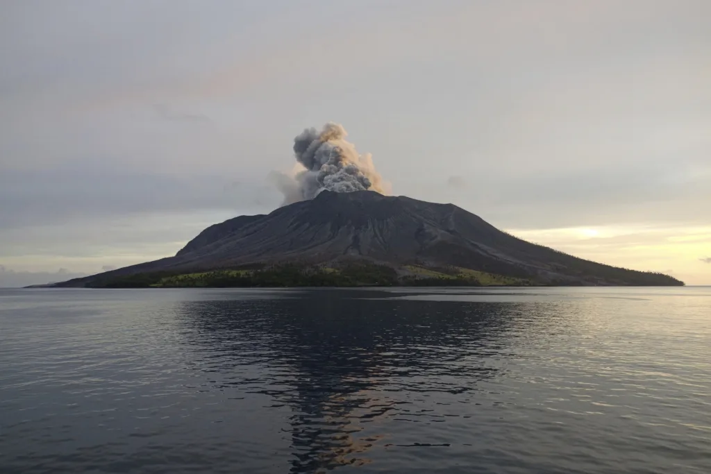 Airport near volcano reopens as Indonesia lowers eruption alert level ...