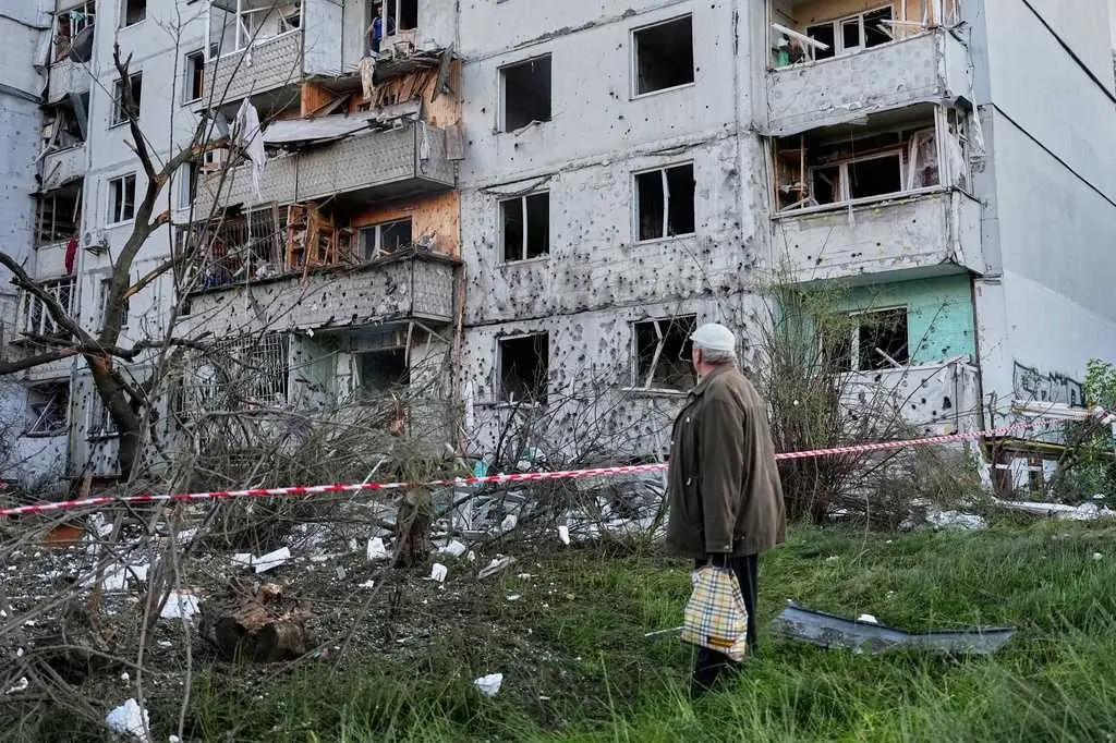 Russian attack on Ukraine kills at least 11 and traps others in damaged ...
