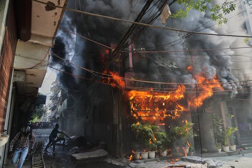 Fire sweeps through New Delhi building, killing at least 18 people ...