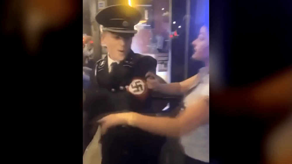 Viral video shows Georgia man in Nazi uniform hitting woman outside bar ...
